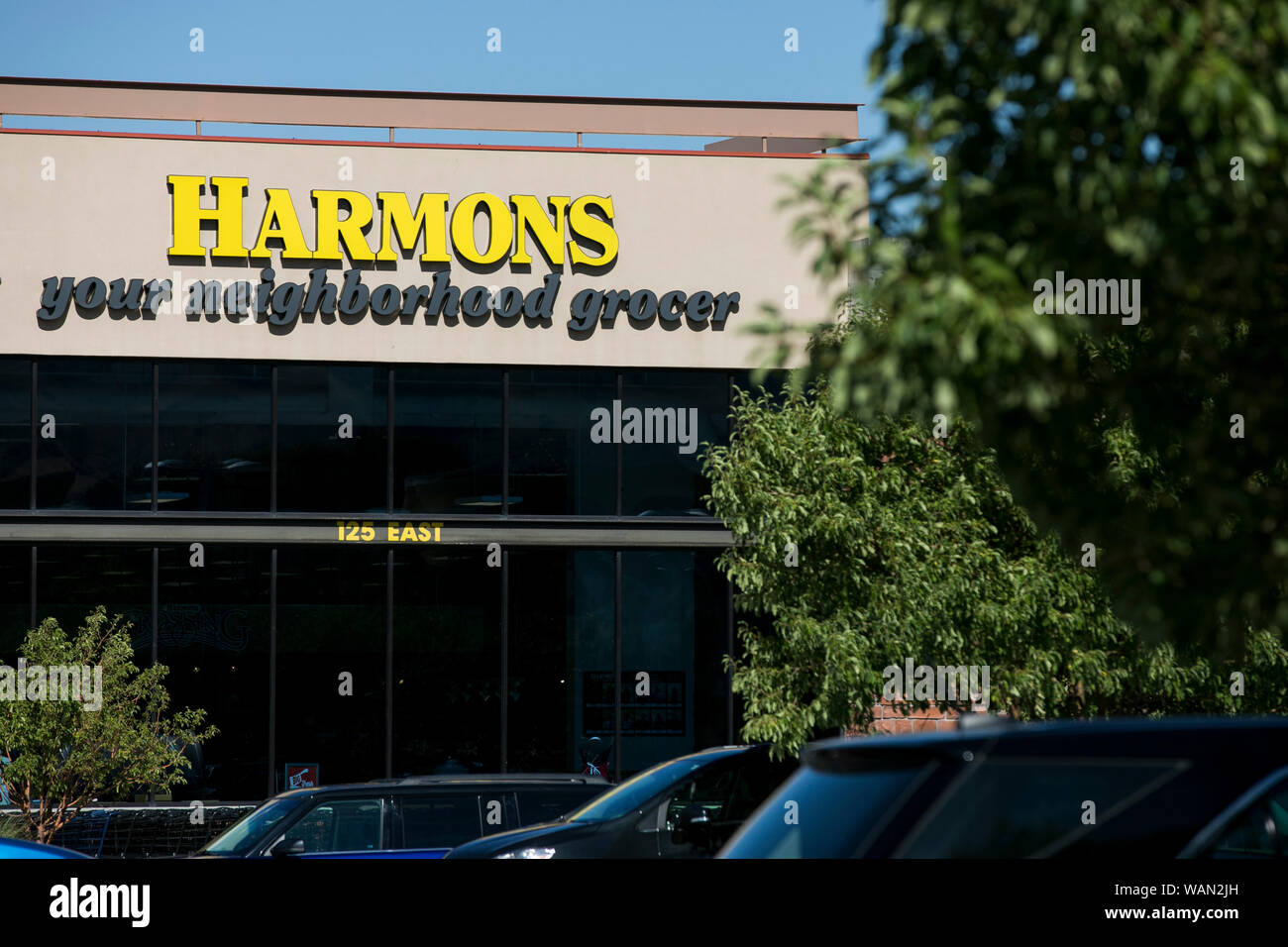 A logo sign outside of a Harmons retail grocery store location in Lehi, Utah on July 30, 2019 ...