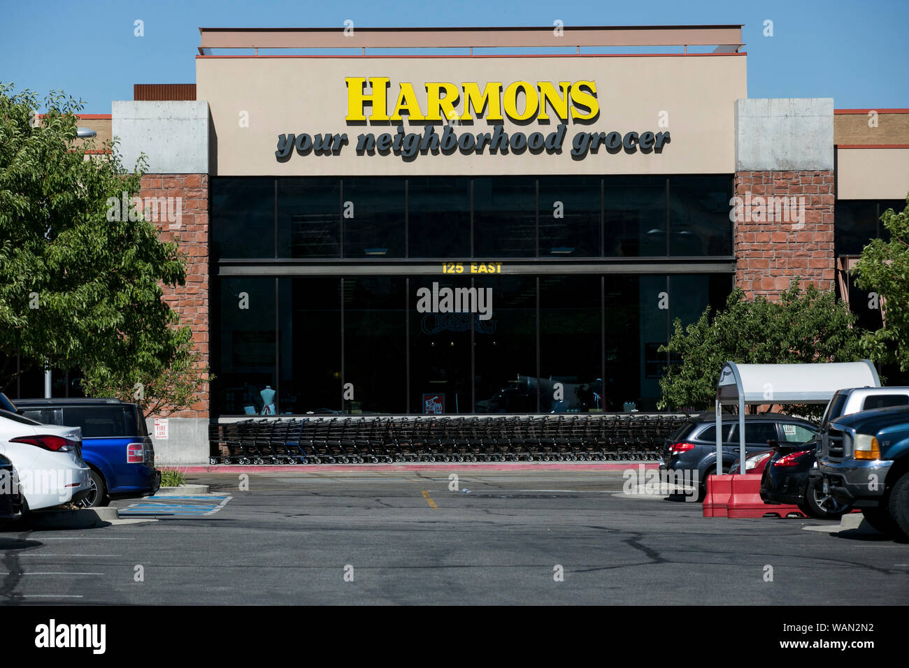 A logo sign outside of a Harmons retail grocery store location in Lehi, Utah on July 30, 2019 ...