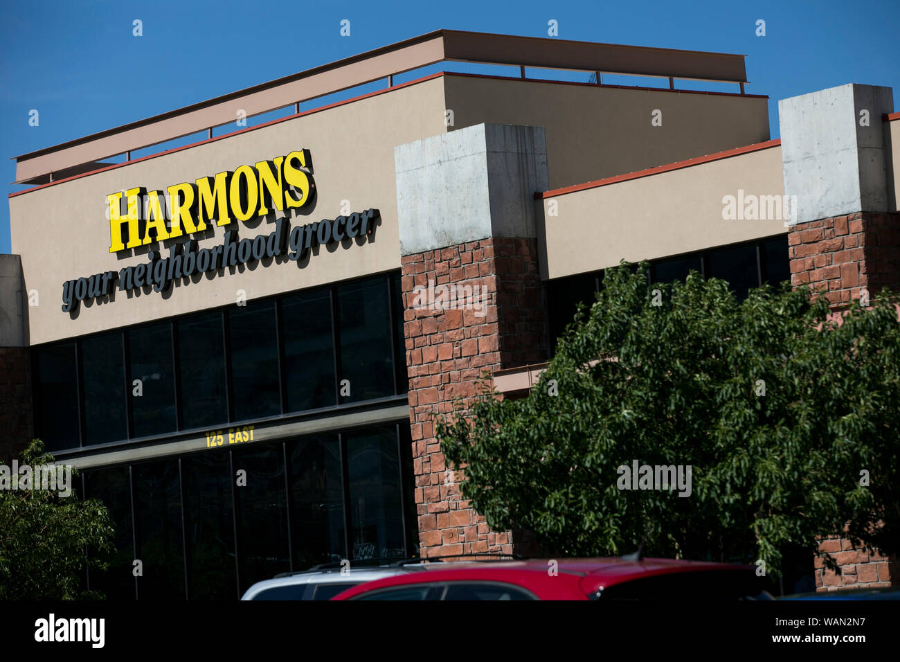 A logo sign outside of a Harmons retail grocery store location in Lehi, Utah on July 30, 2019 ...