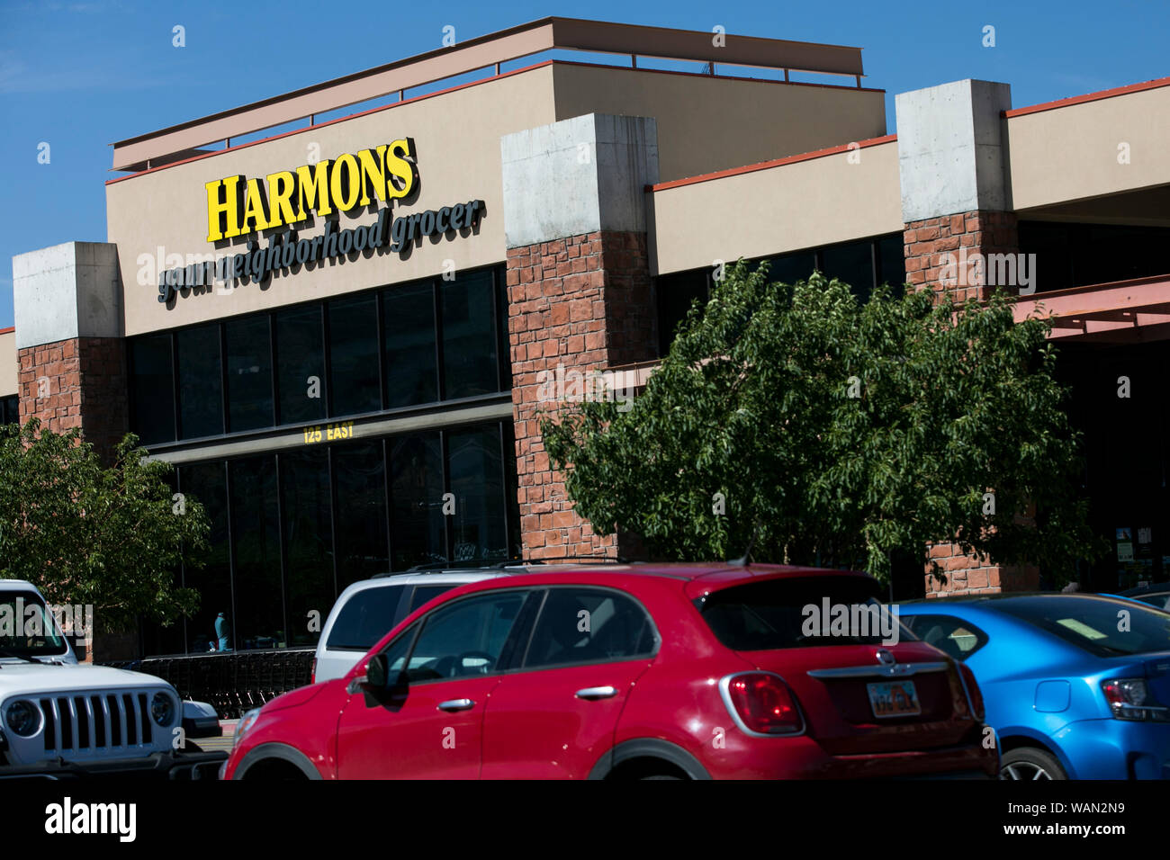 A logo sign outside of a Harmons retail grocery store location in Lehi, Utah on July 30, 2019 ...