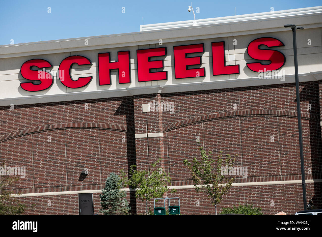 A logo sign outside of a SCHEELS retail store location in Sandy, Utah ...