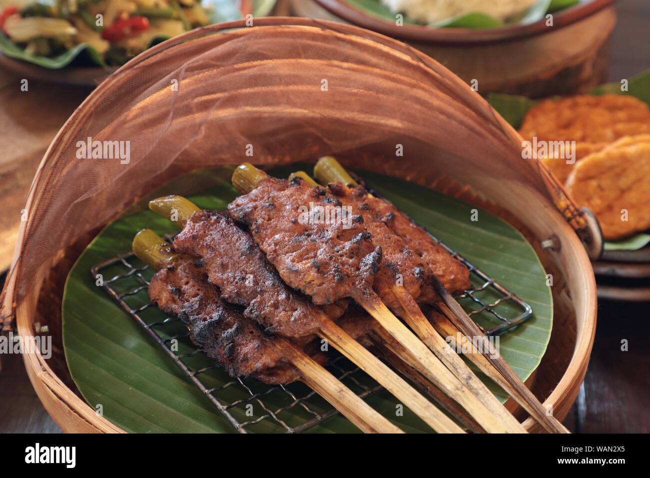 Sate Ayam Japit. Char-grilled spice-coated chicken chunks in bamboo ...