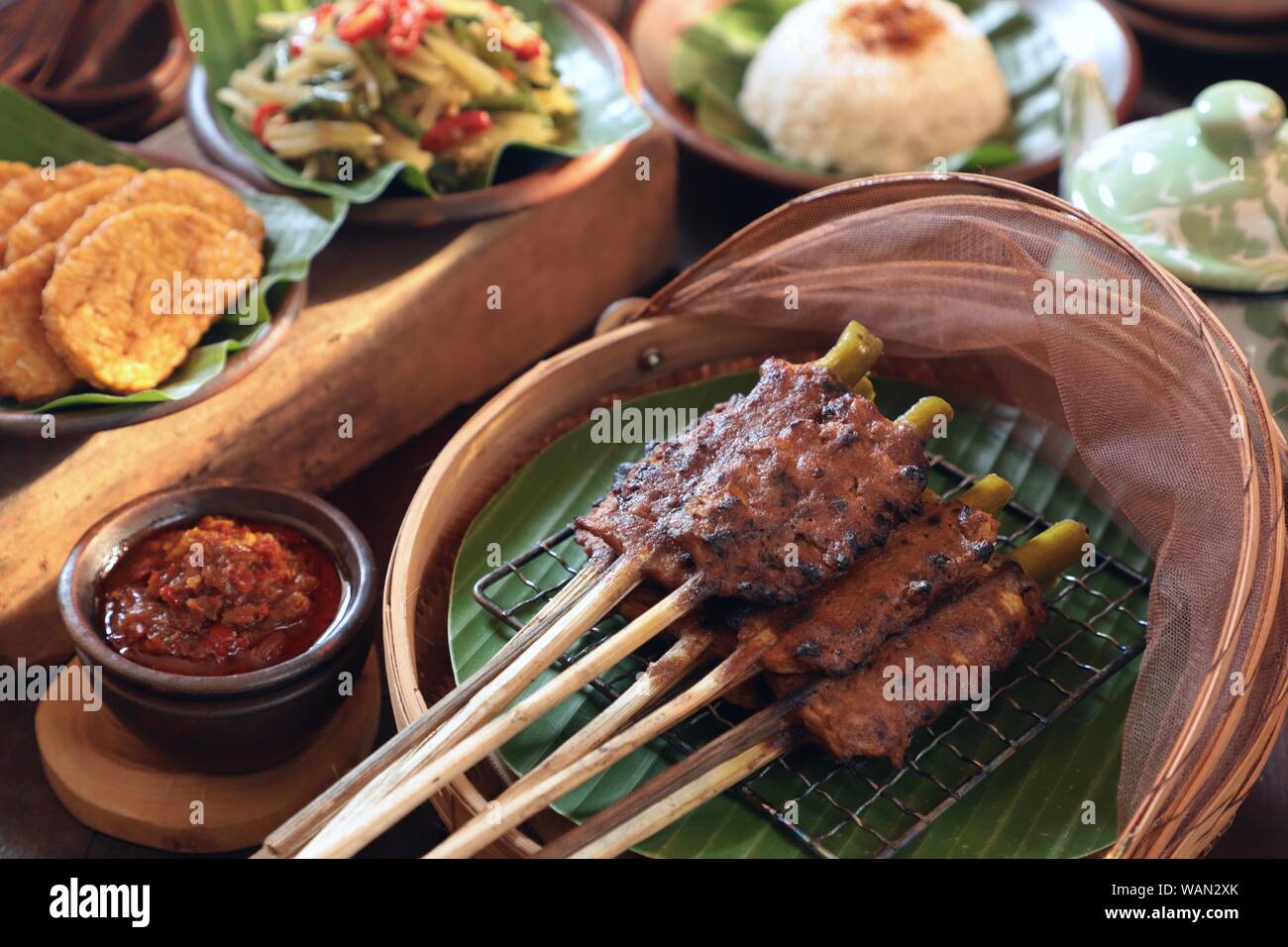 Sate Ayam Japit. Char-grilled spice-coated chicken chunks in bamboo ...