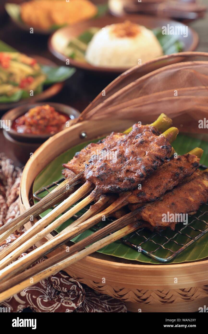 Sate Ayam Japit. Char-grilled spice-coated chicken chunks in bamboo ...