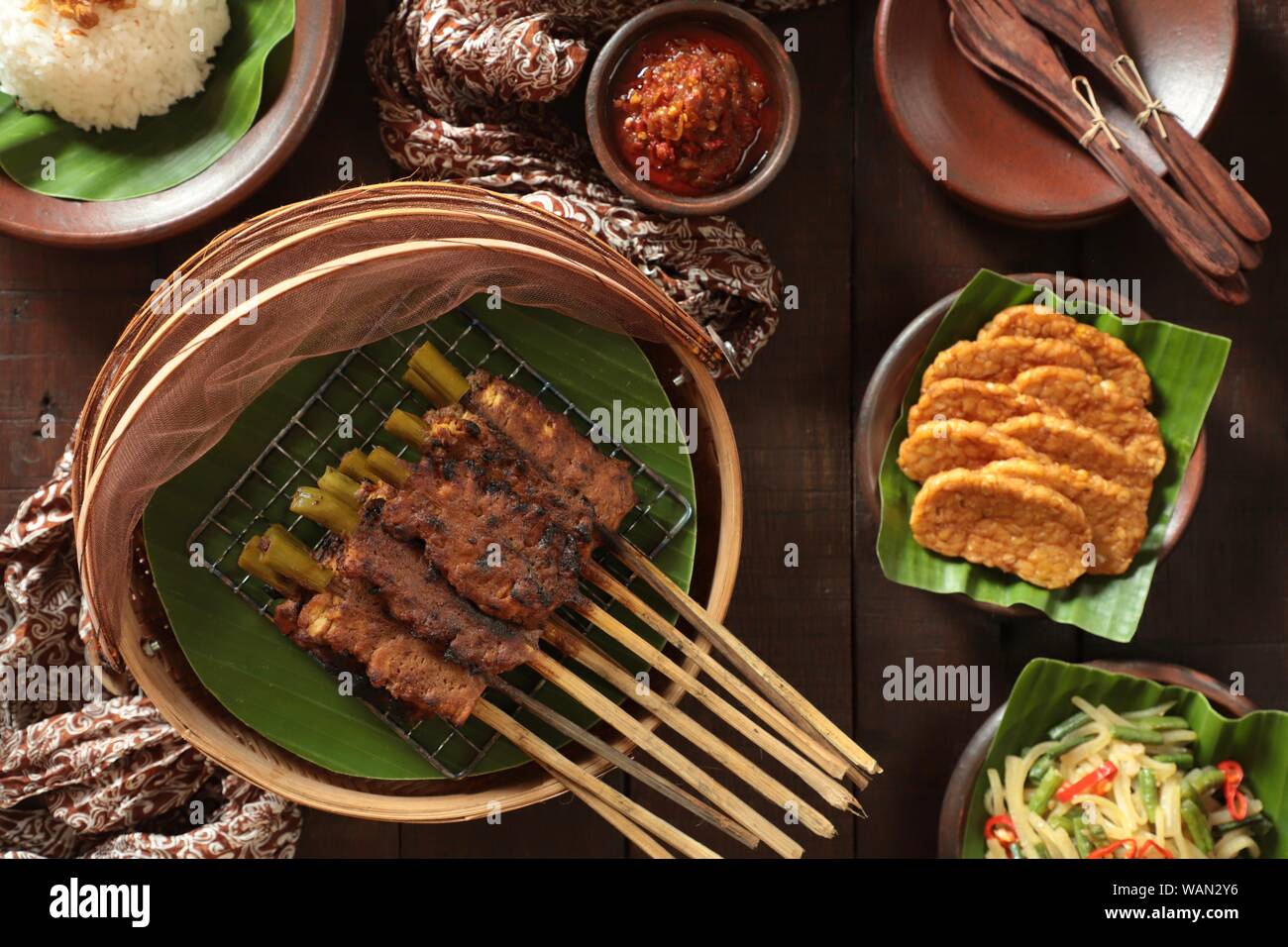 Sate Ayam Japit. Char-grilled spice-coated chicken chunks in bamboo ...