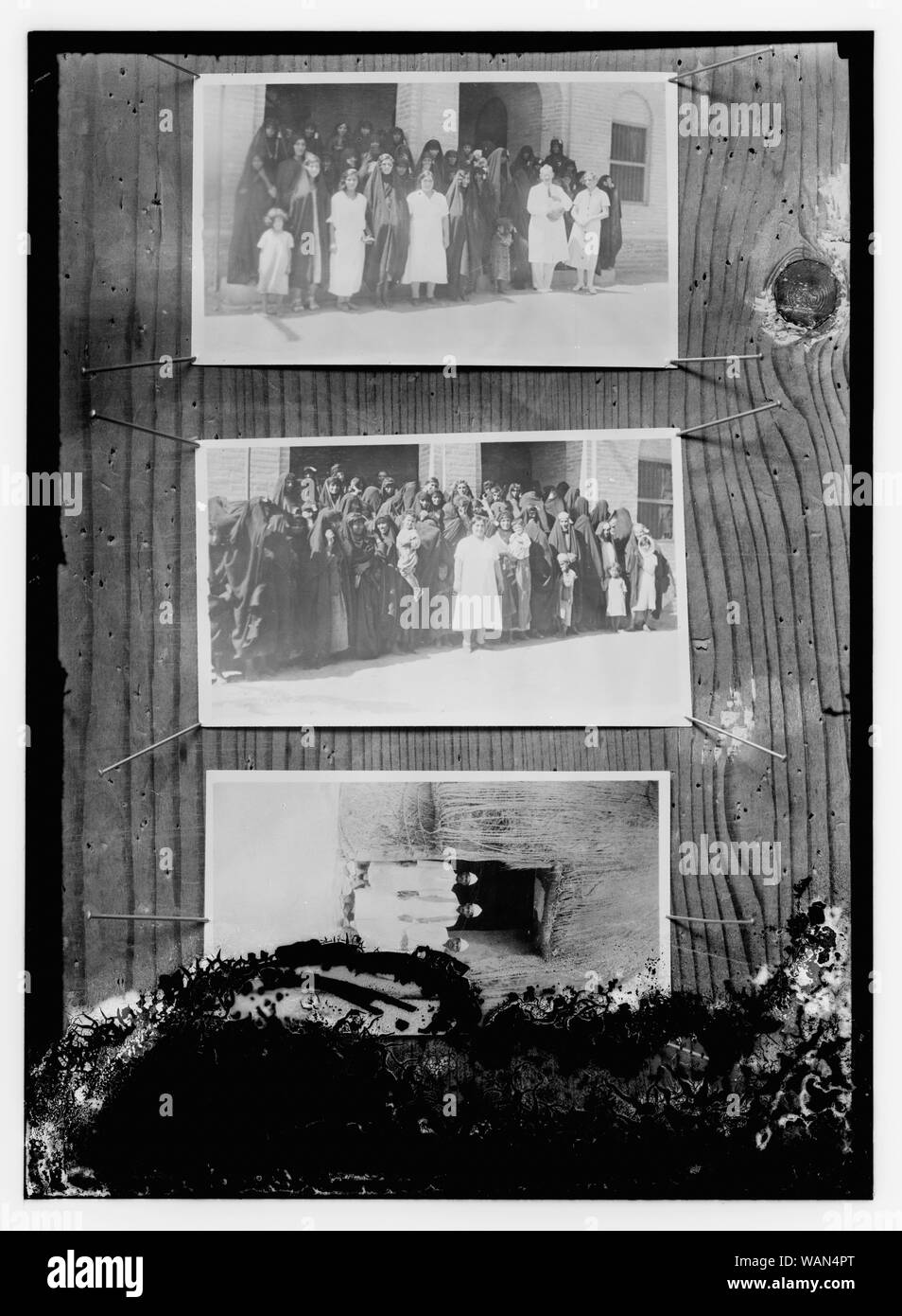 Copy of photographs showing: Man and women, some wearing back robes ...