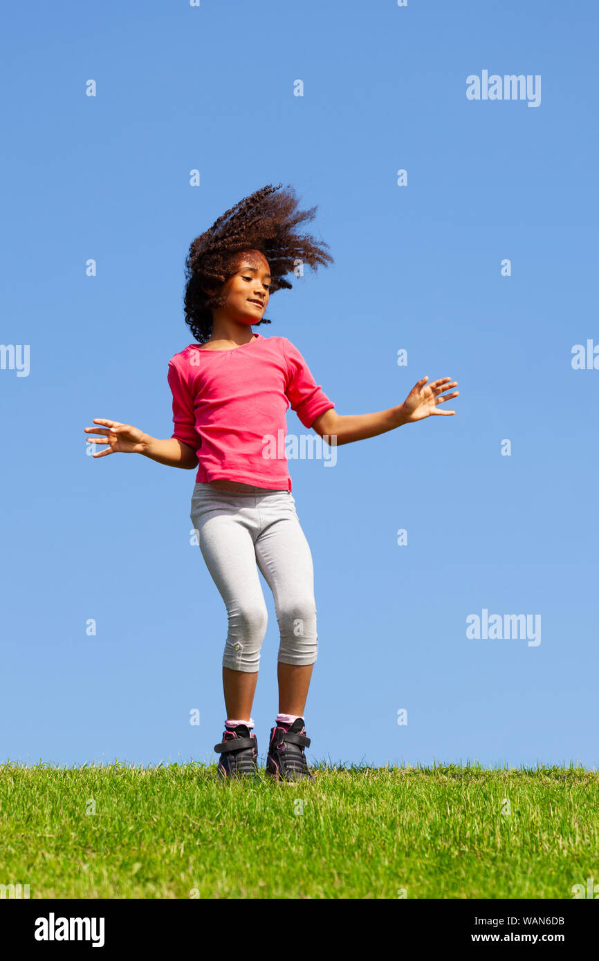 Little girl on grass hi-res stock photography and images - Alamy