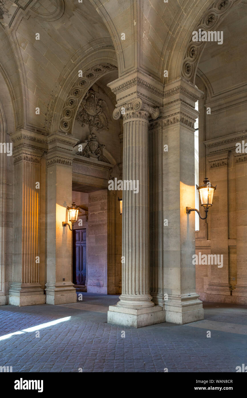 Columns and arched ceiling in passageway to Musee du Louvre courtyard ...
