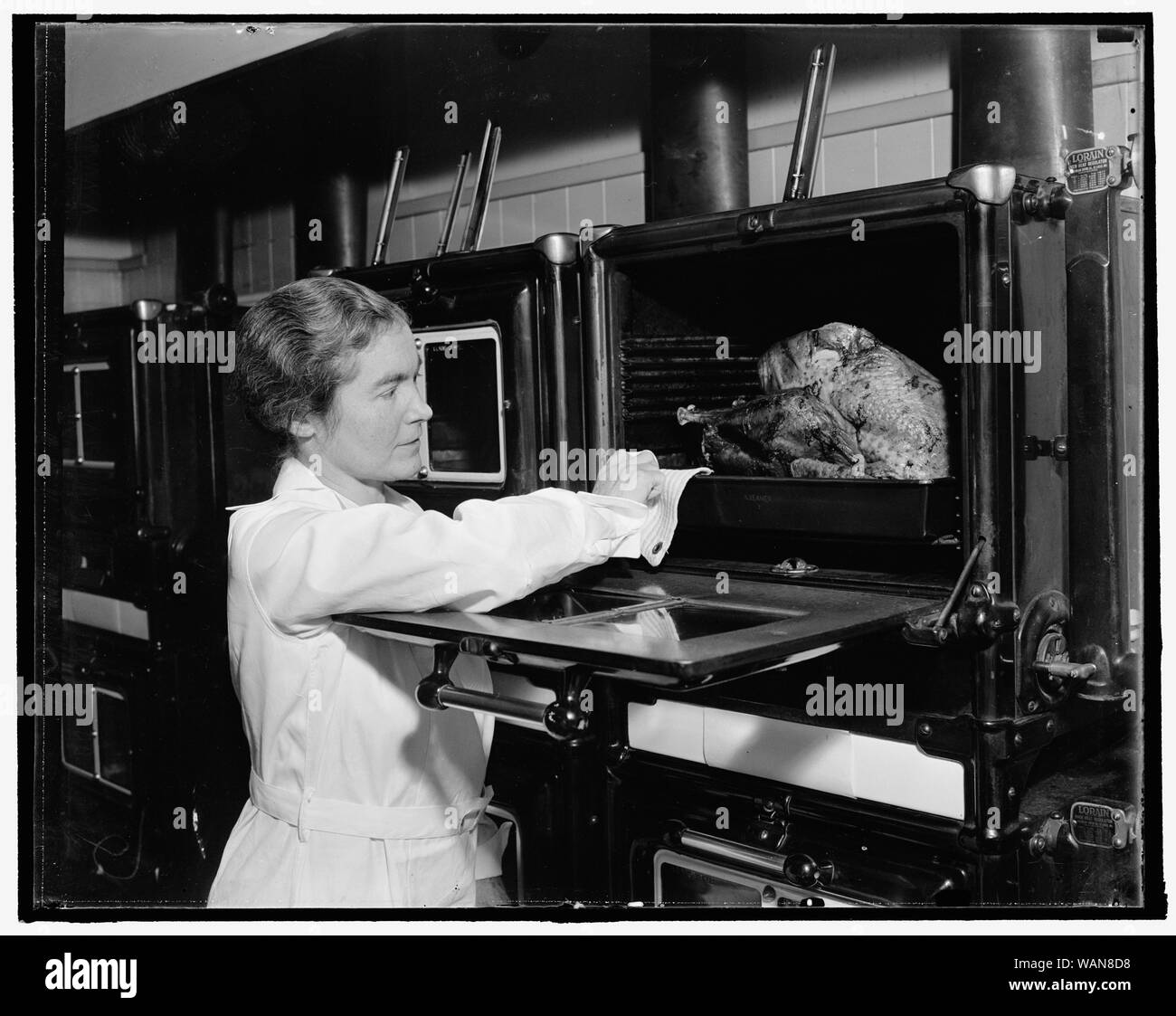 Correct way to bake turkey. Miss Alexander removes the bird from oven ...