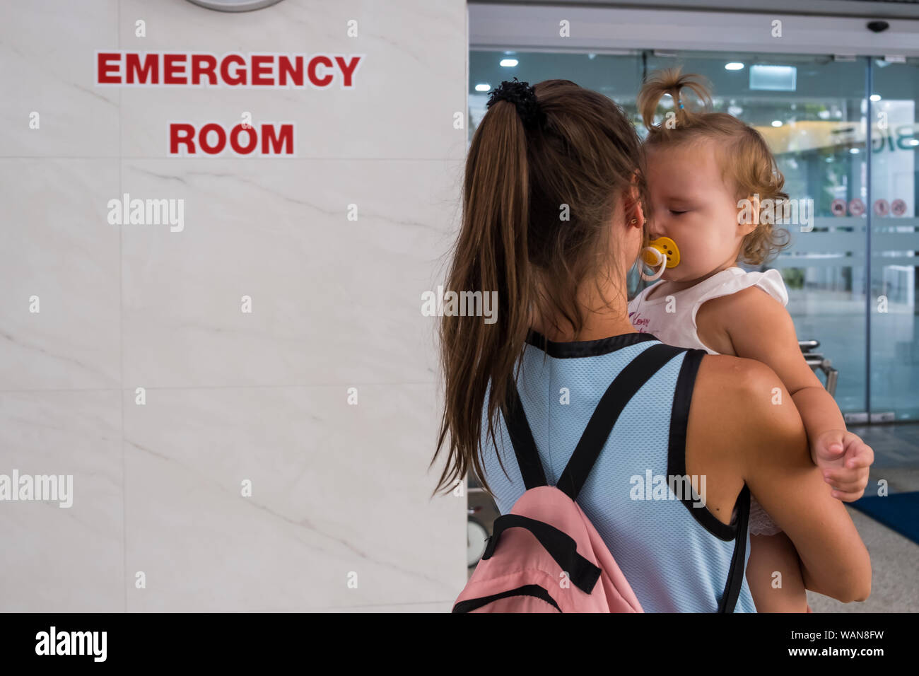 Mom and child come in in the emergency room at the hospital in Pattaya ...