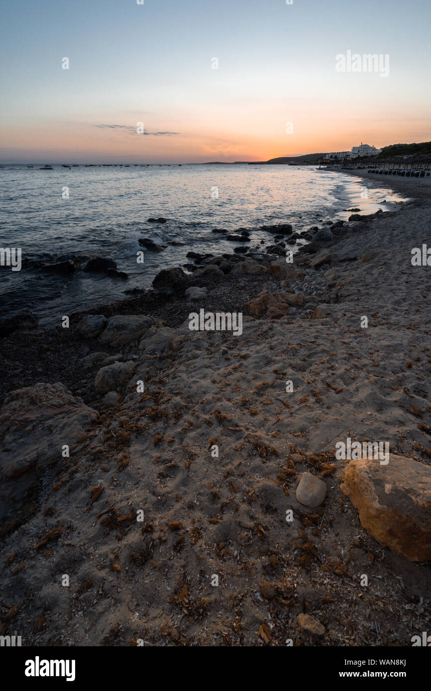 Sunset time in Santo Tomas beach on the island of Menorca Stock Photo ...
