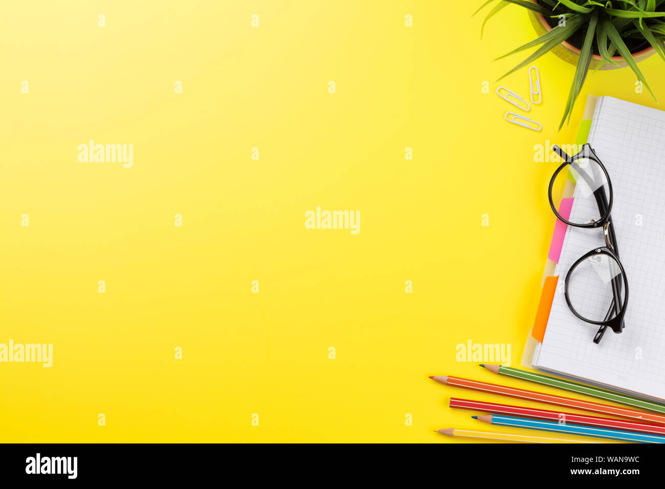 Office yellow workplace backdrop with supplies and potted plant. Flat ...