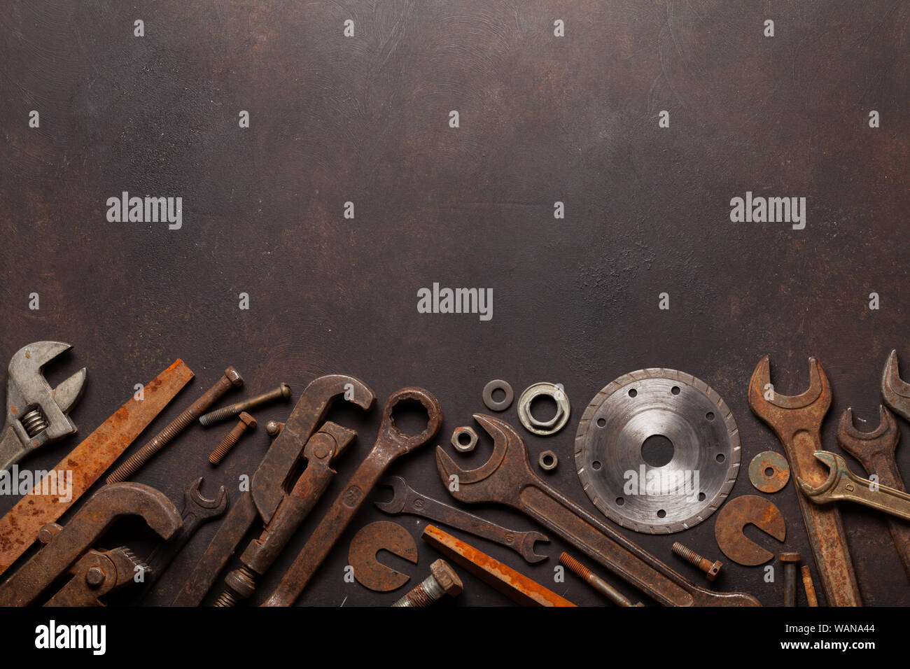 Vintage old tools on stone backdrop. Top view with copy space. Flat lay ...