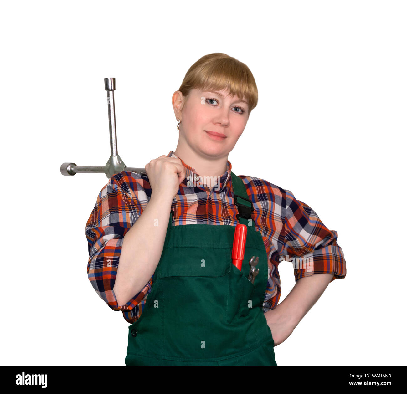 female auto mechanic in bib overalls with spider-type lug wrench ...