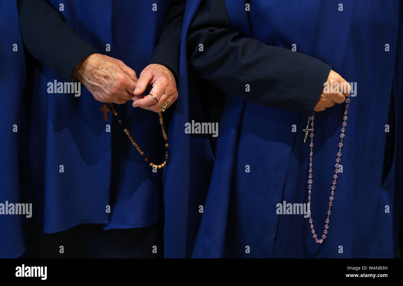 Members of 'Cairde Mhuire' hold rosary beads during mass in the ...