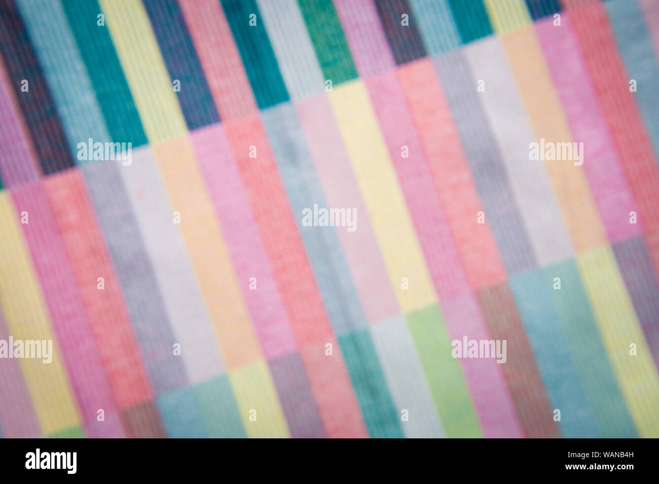 Colorful abstract textile background in a full frame close-up of angled ...