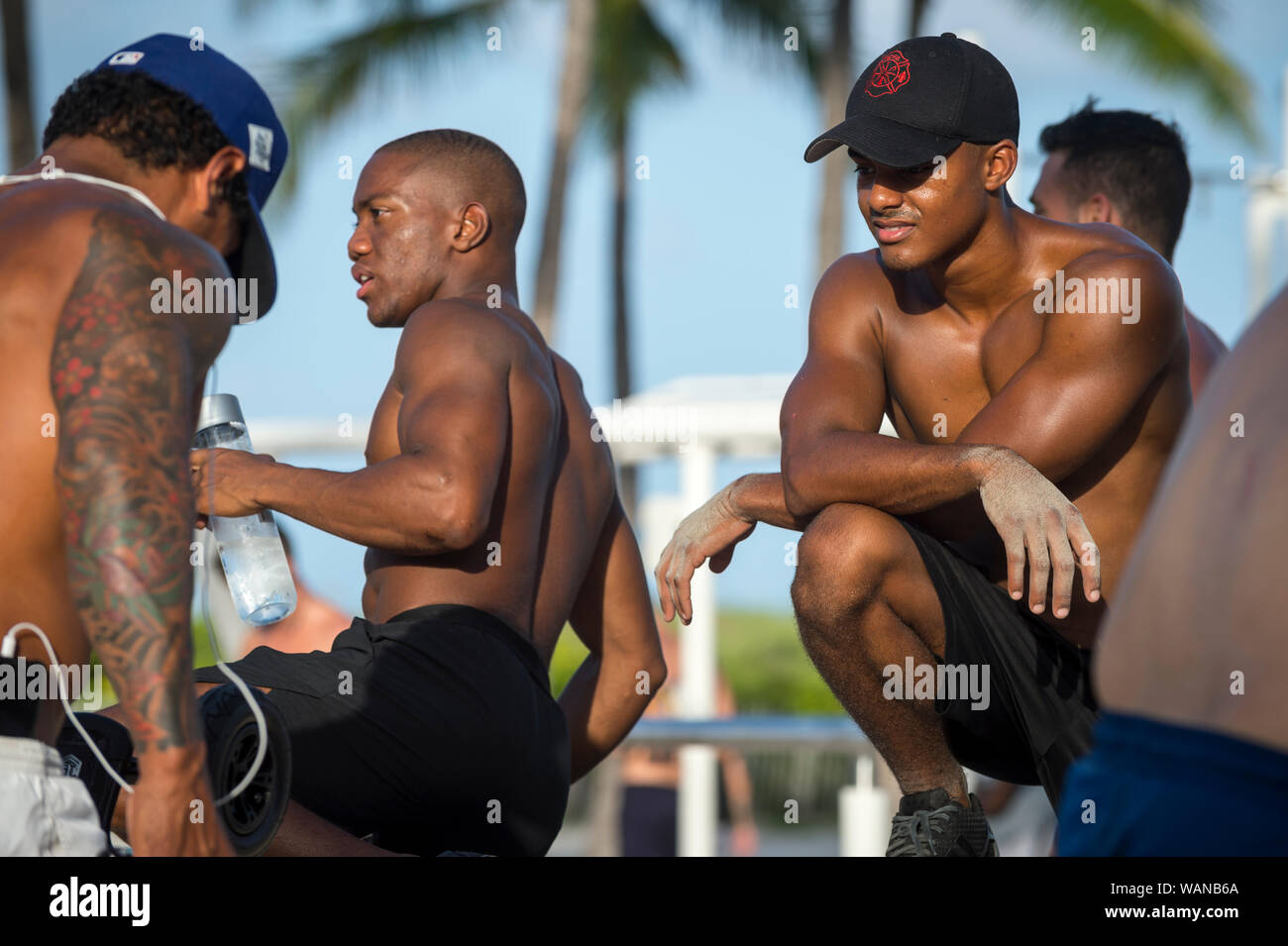 MIAMI - AUGUST 18, 2019: Muscular young men socialise at Muscle Beach ...
