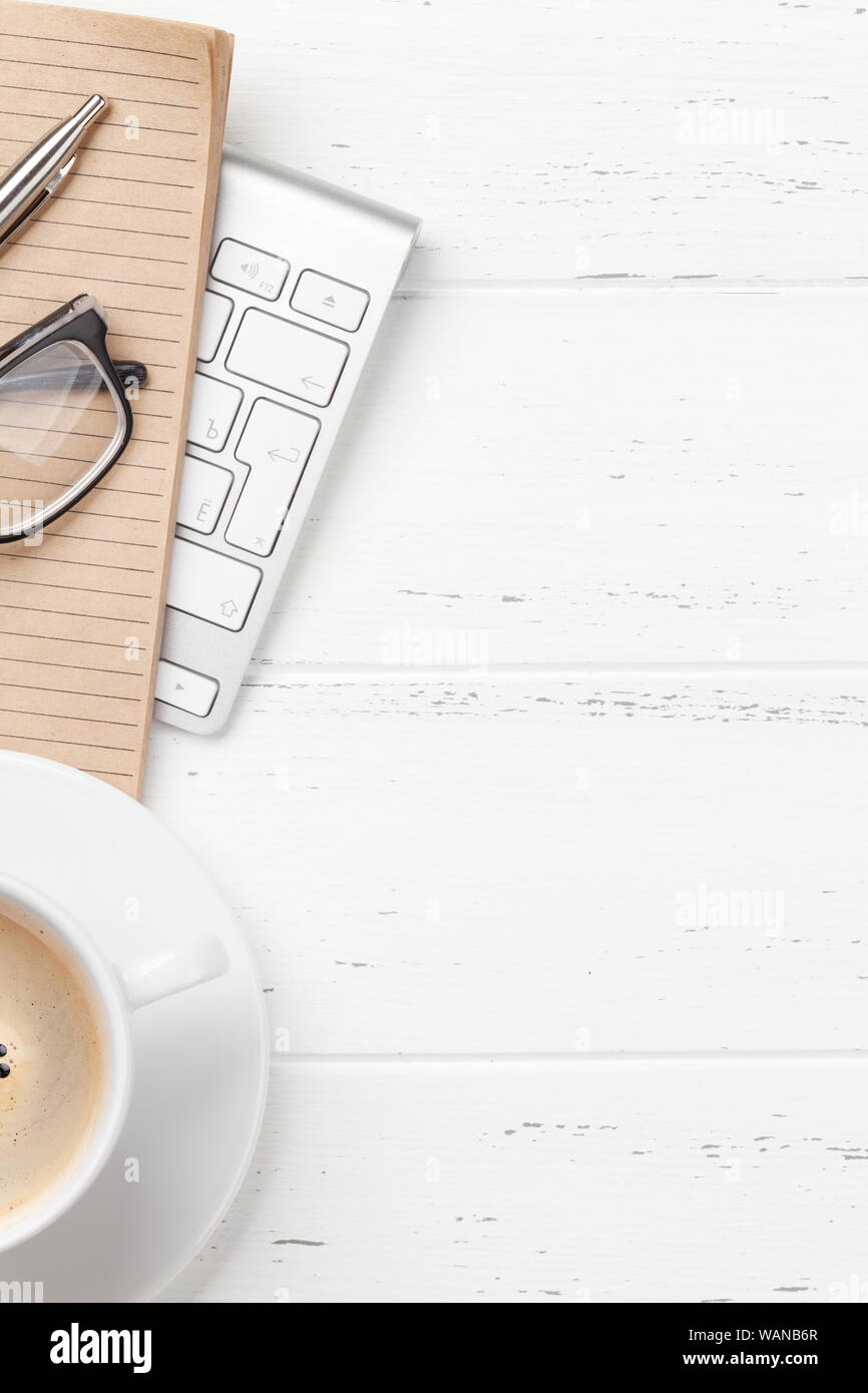 Office workplace table with coffee cup, supplies and computer. Flat lay ...