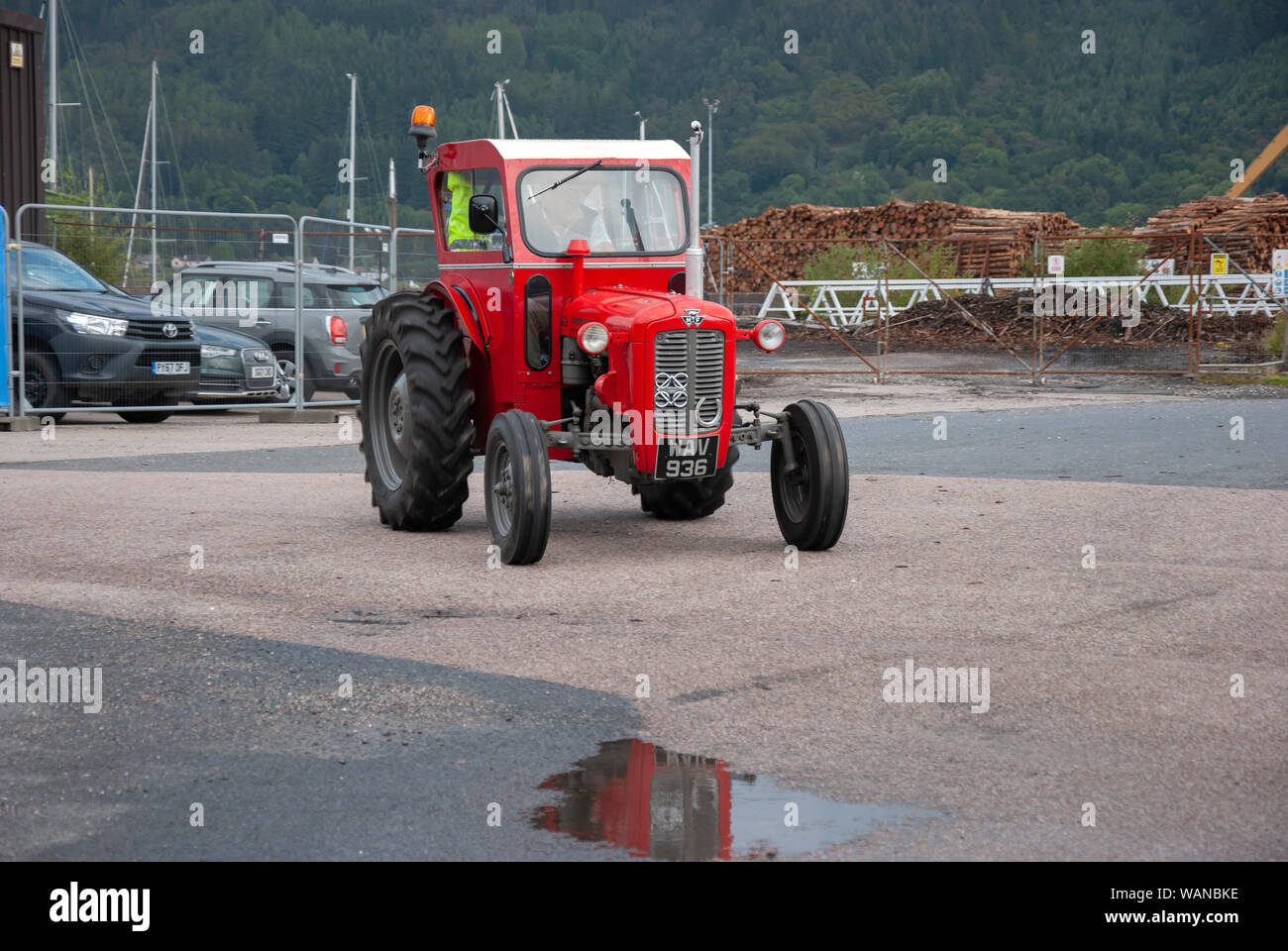 Man Driving 1962 Vintage Red White Massey Ferguson 35 Model Tractor ...