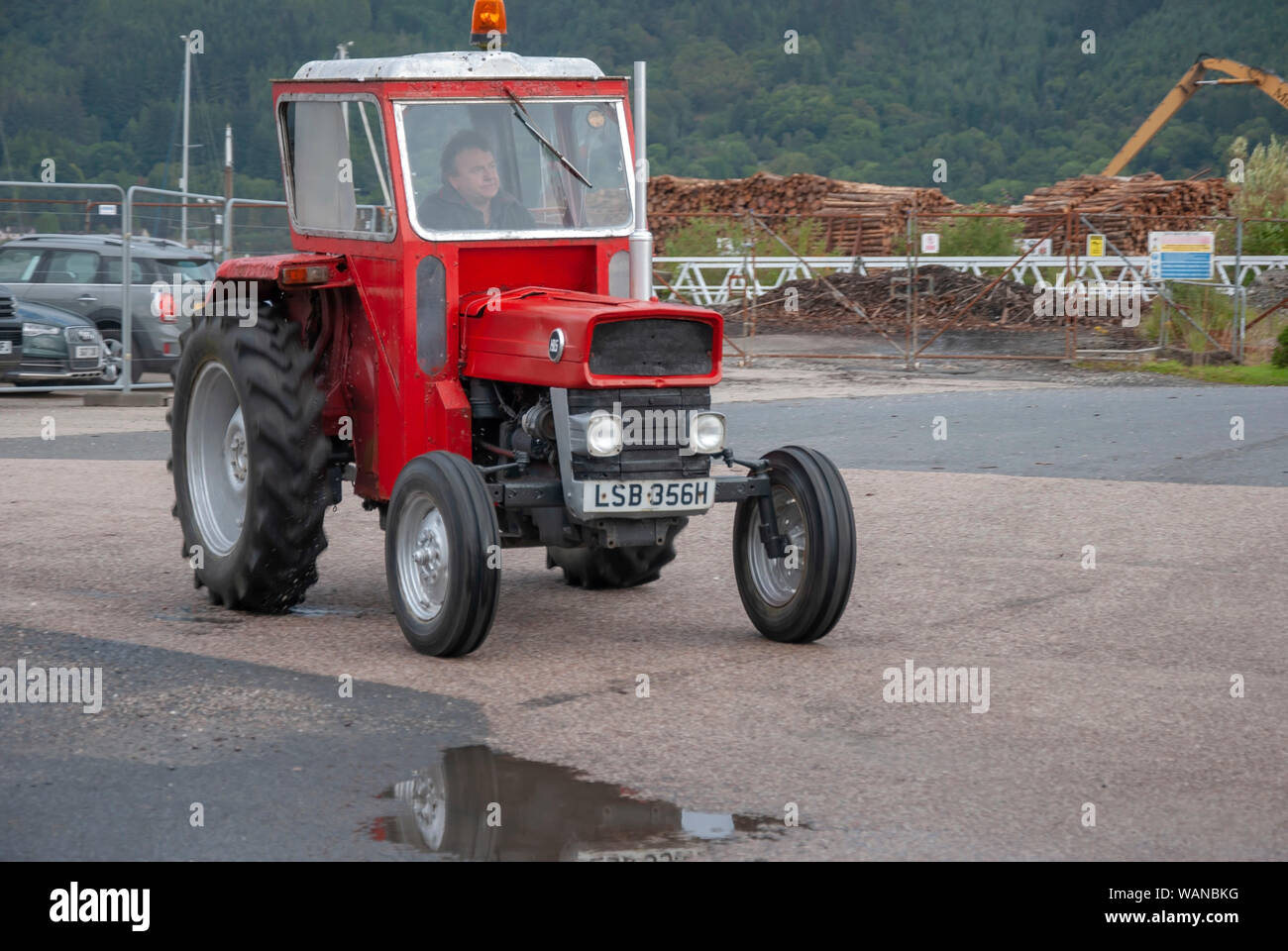 Man Driving 1970 Vintage Red White Massey Ferguson 135 Model Tractor ...