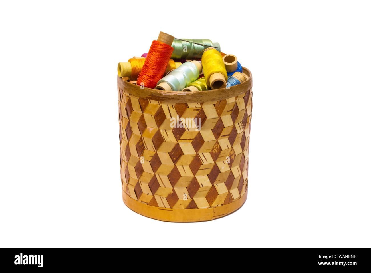 braided manually birchbark cylindrical box with spools of colored ...