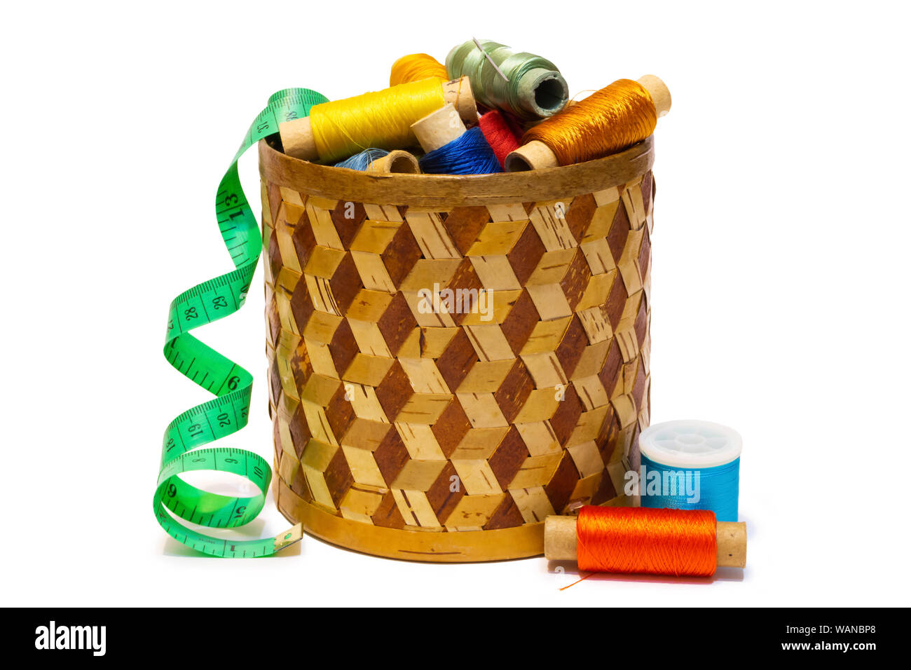 braided manually birchbark cylindrical box with spools of colored ...