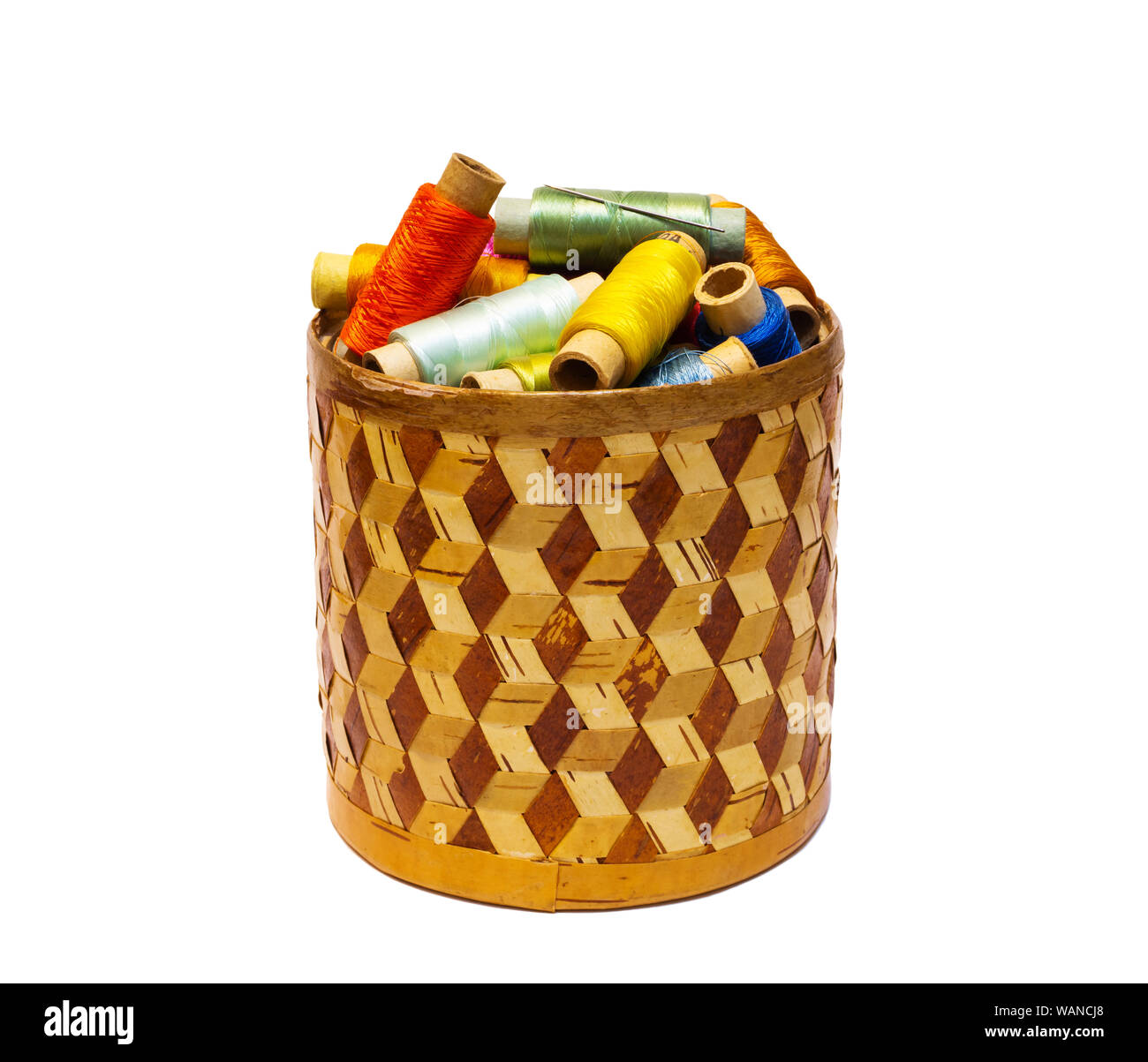 braided manually birchbark cylindrical box with spools of colored ...
