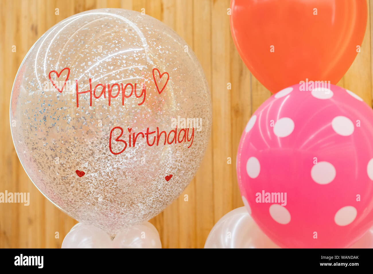 a happy birthday text on the balloon for gift in the birthday party ...
