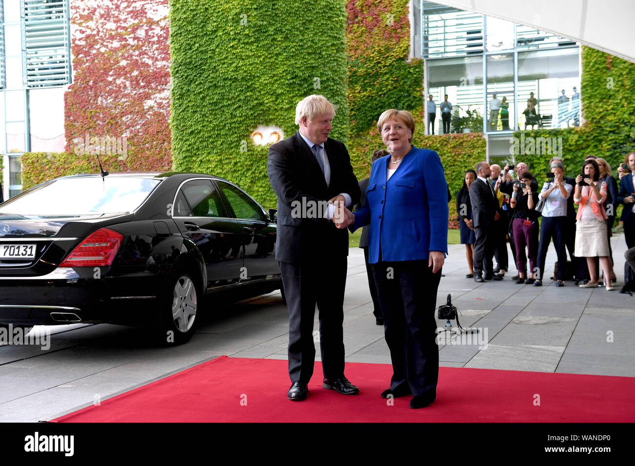 Prime Minister Boris Johnson meets German Chancellor Angela Merkel in ...