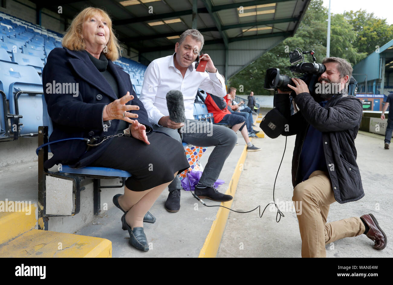 Former director Joy Hart handcuffs herself to a seat inside Gigg Lane ...