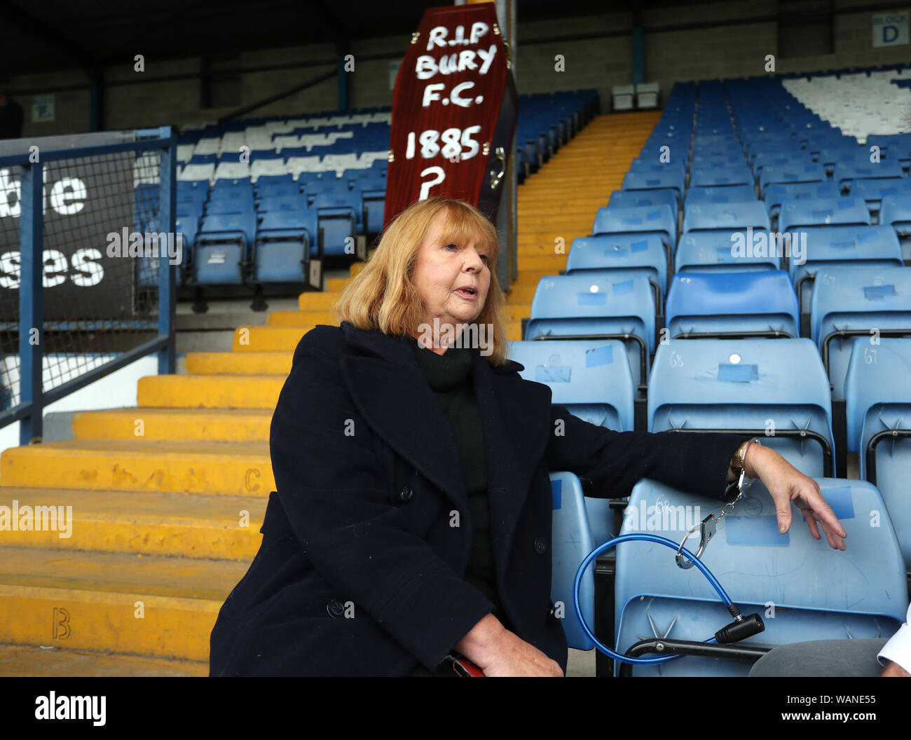 Former director Joy Hart handcuffs herself to a seat inside Gigg Lane ...