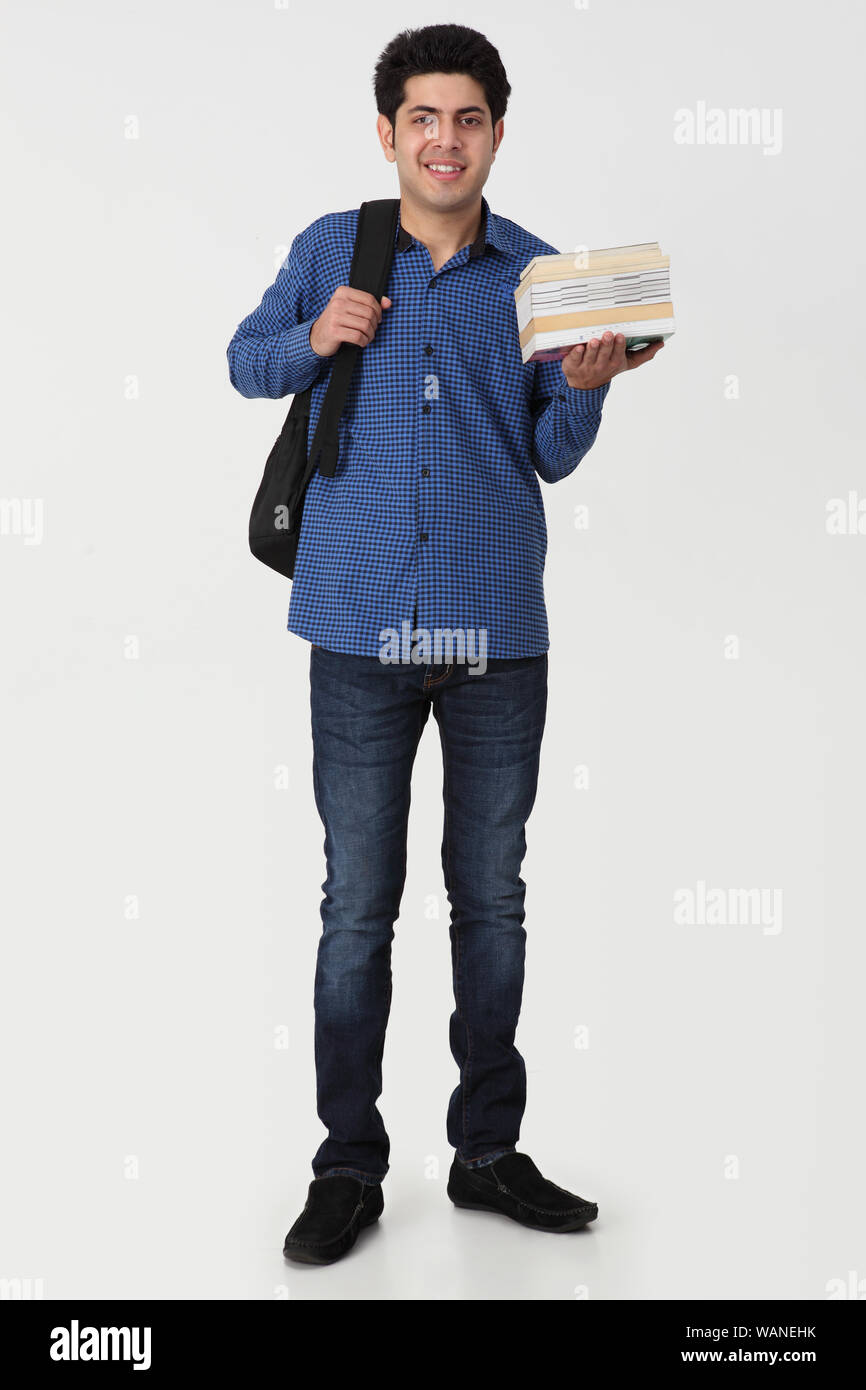 Boy holding textbook front class hi-res stock photography and images ...