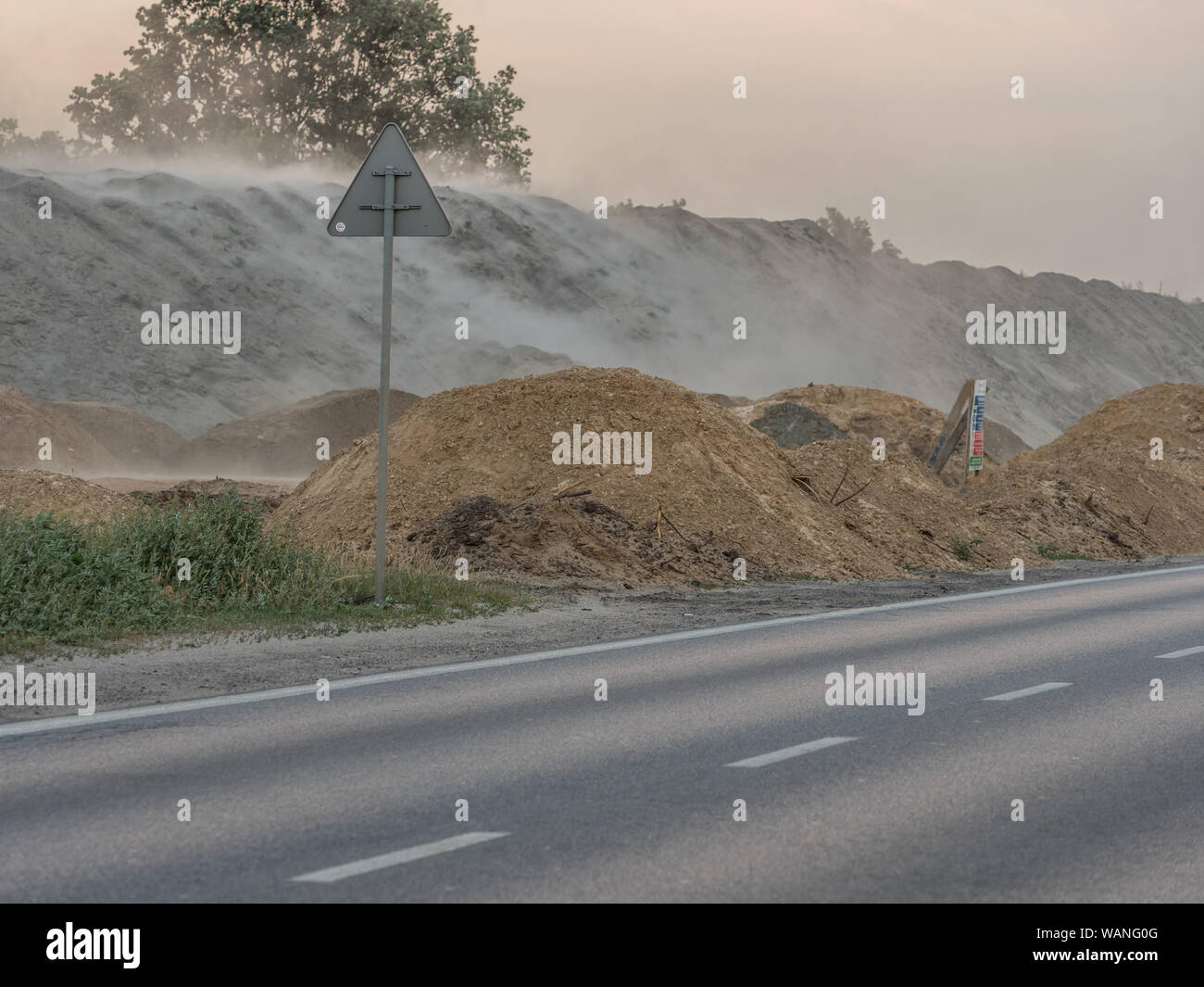Strong wind grabs sand and reduce visibility on the road Stock Photo ...