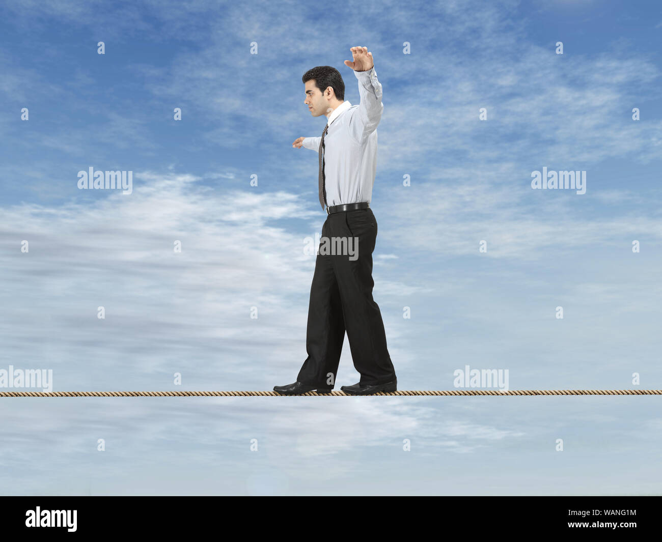 Man balancing on rope hi-res stock photography and images - Alamy