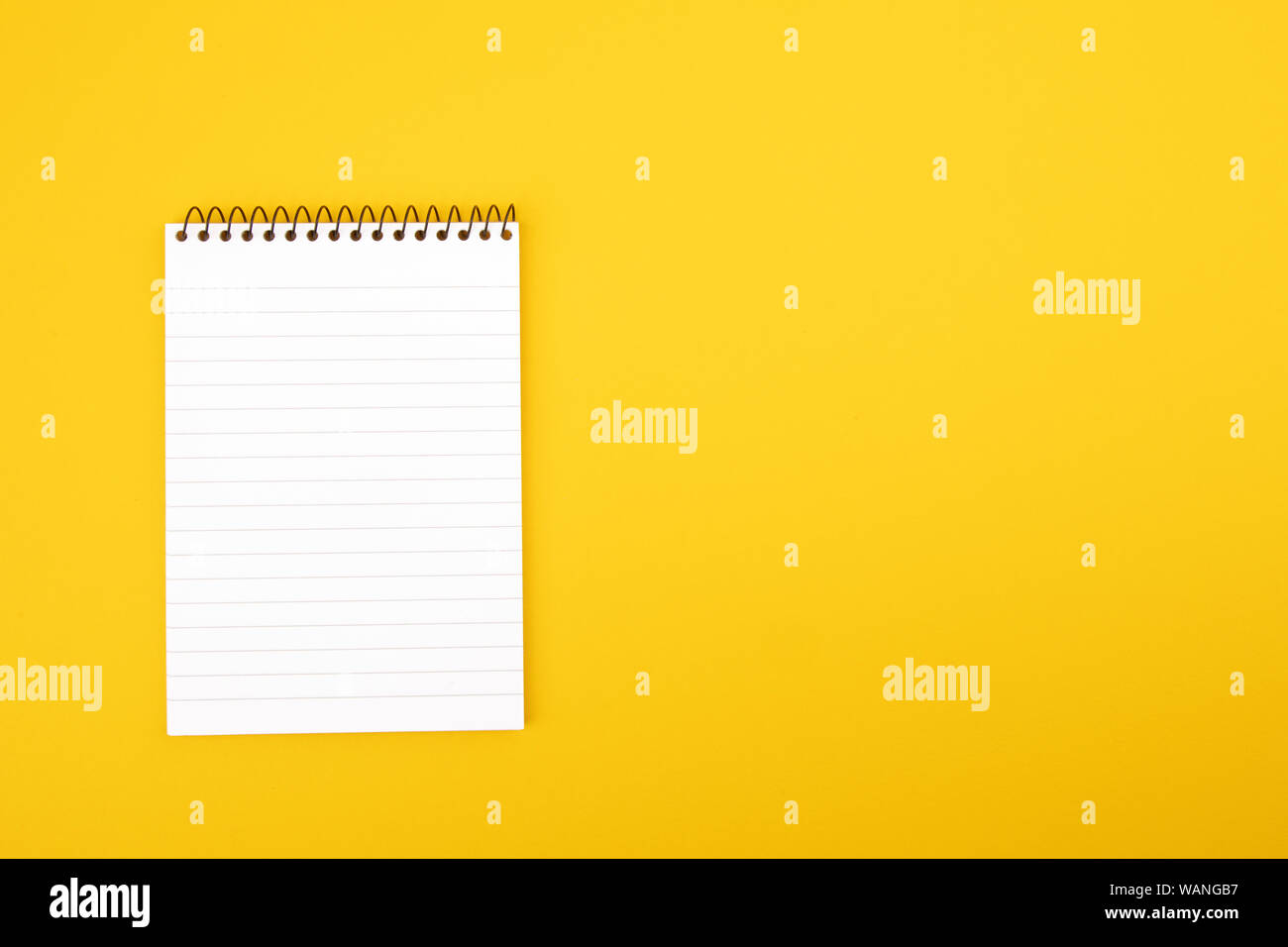 Top View Paper Notepad on yellow cardboard Stock Photo - Alamy