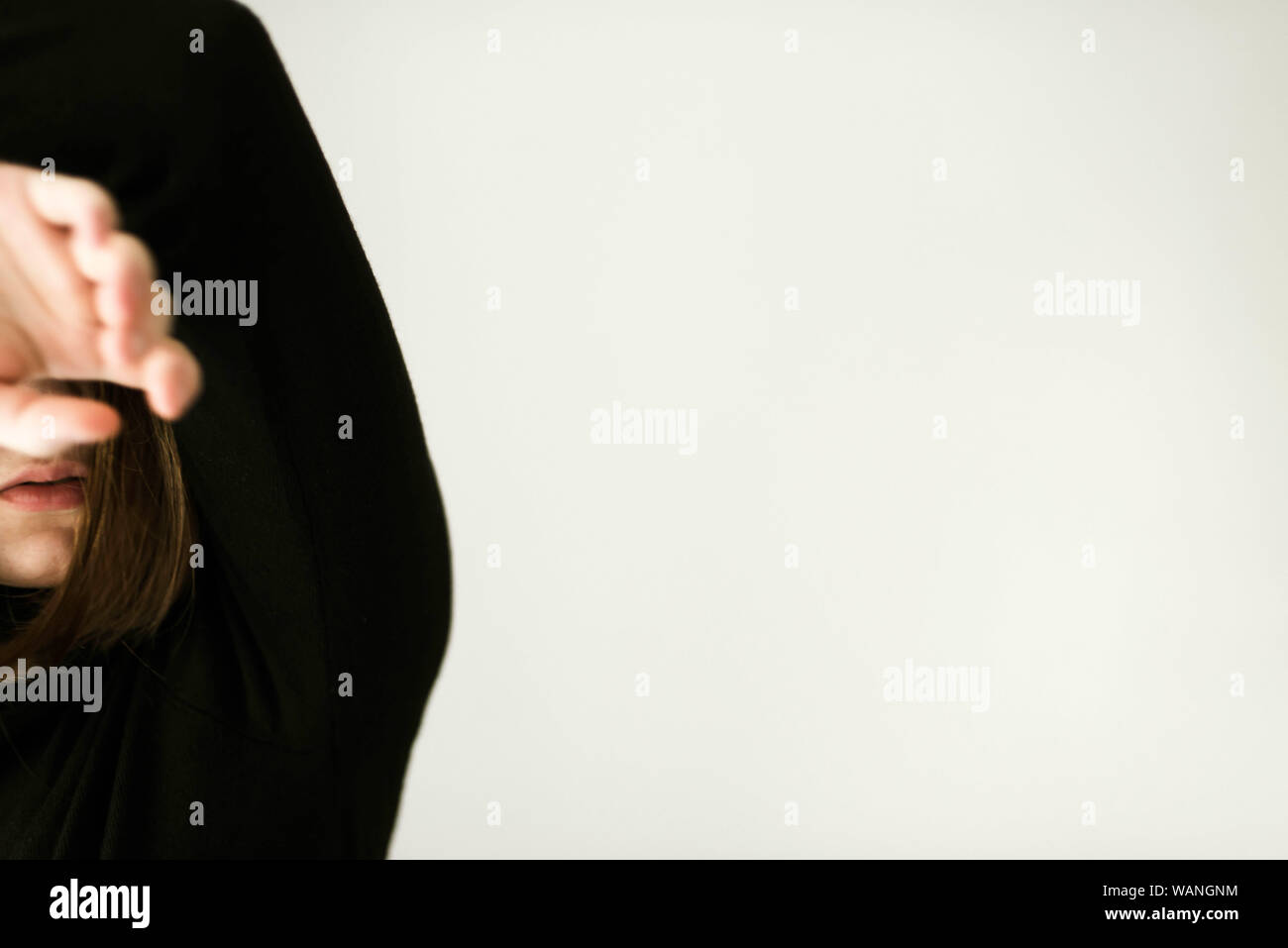 Portrait of woman against white background Stock Photo - Alamy