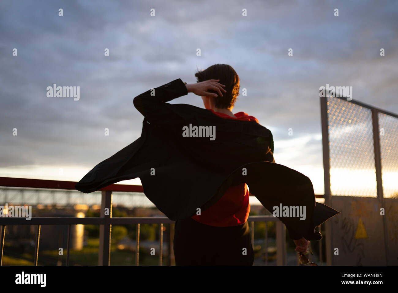 woman view from the back standing on the bridge Stock Photo - Alamy