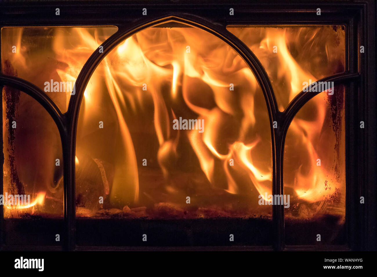 Daancing flames of fire inside a woodburning stove in UK Stock Photo ...
