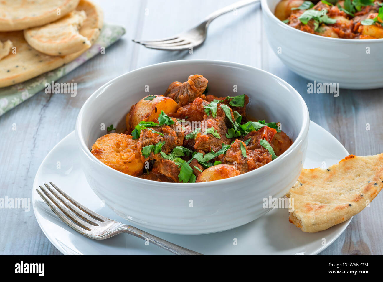 Aloo gosht with naan bread - lamb and potato curry - cuisine popular in ...
