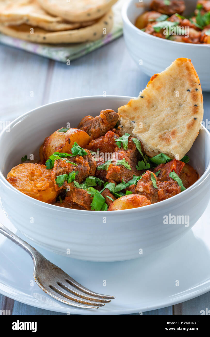 Aloo gosht with naan bread - lamb and potato curry - cuisine popular in ...