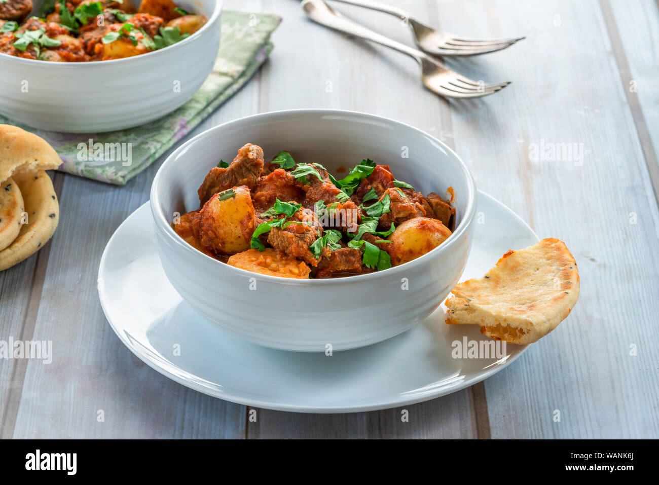 Aloo gosht with naan bread - lamb and potato curry - cuisine popular in ...