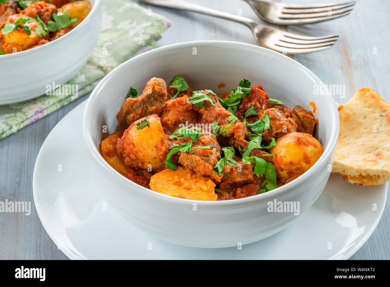 Aloo gosht with naan bread - lamb and potato curry - cuisine popular in ...