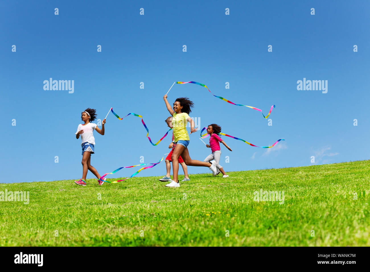 Group of kids waving hi-res stock photography and images - Alamy