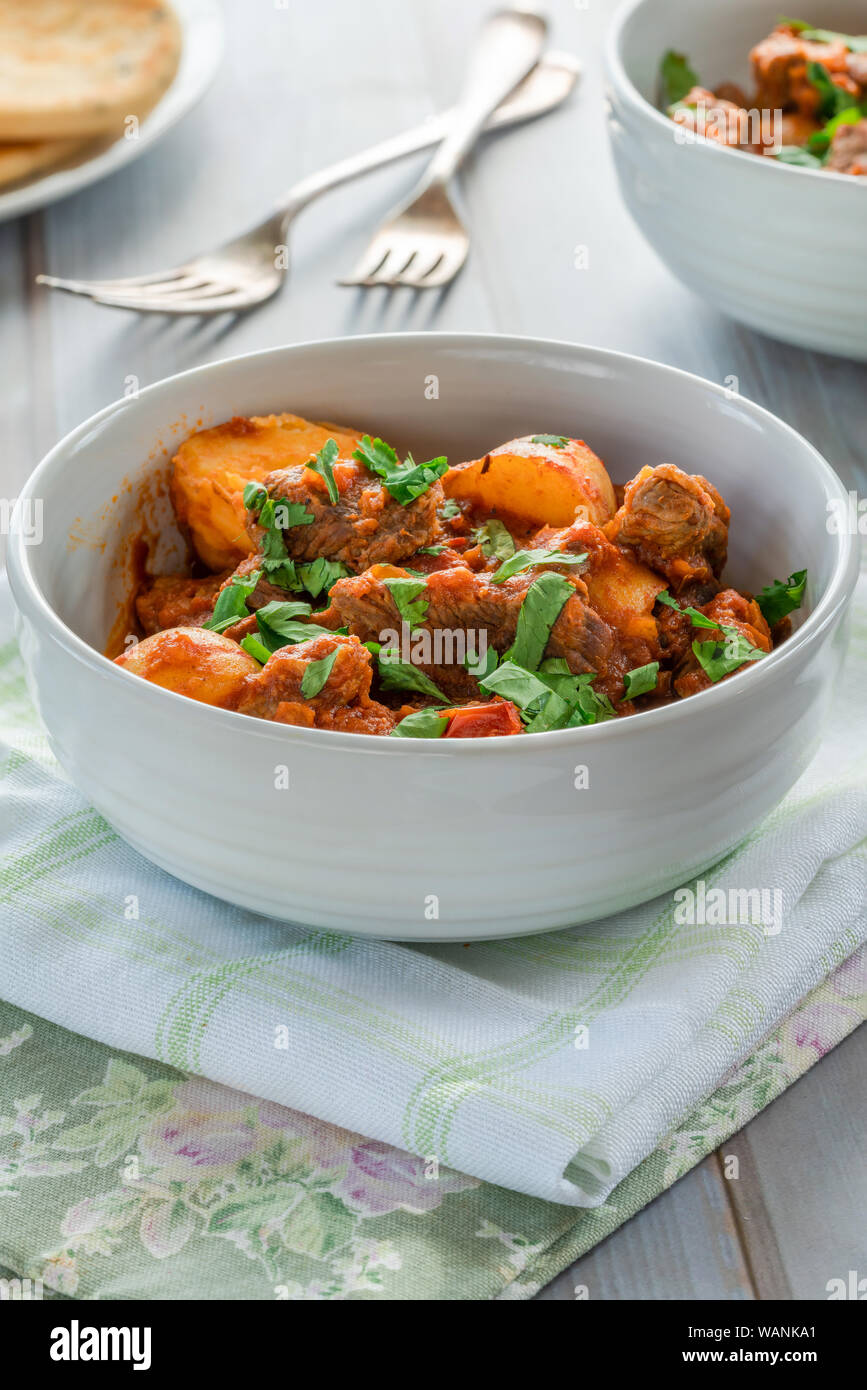 Aloo gosht with naan bread - lamb and potato curry - cuisine popular in ...