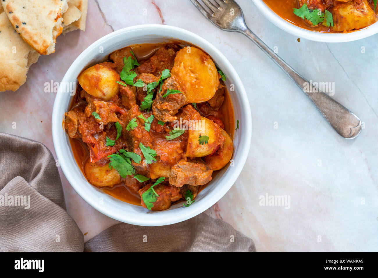 Aloo gosht with naan bread - lamb and potato curry - cuisine popular in ...