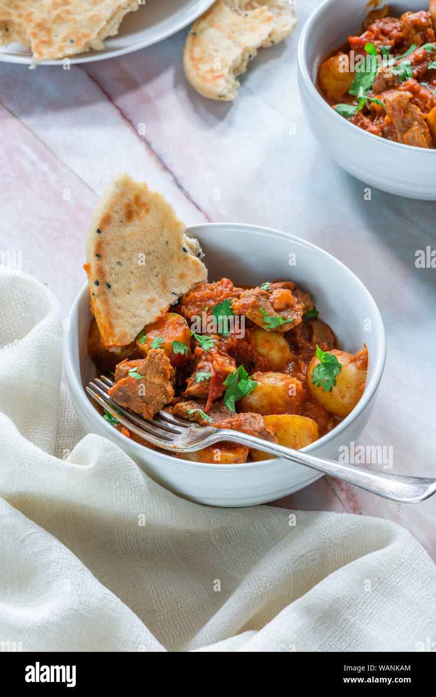 Aloo gosht with naan bread - lamb and potato curry - cuisine popular in ...