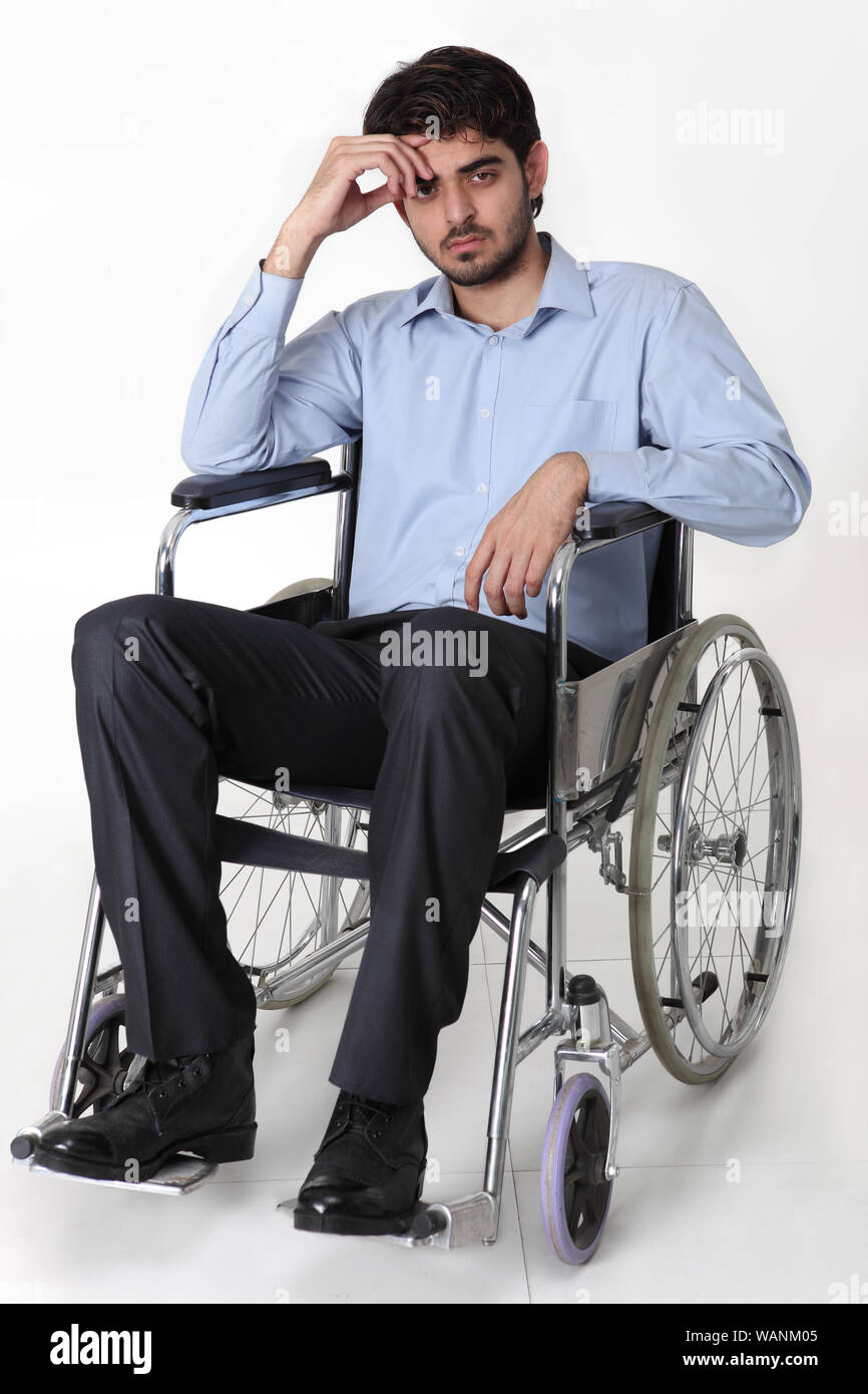 Young indian man in wheelchair hi-res stock photography and images - Alamy
