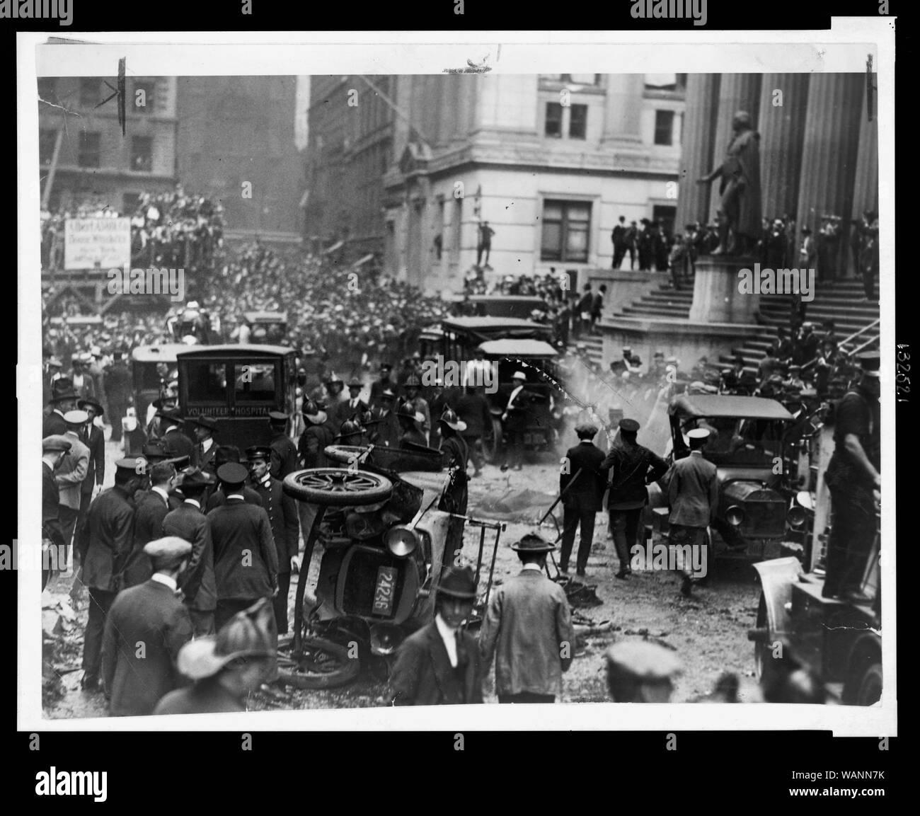 Crowd gathered following the explosion on Wall St., car overturned in ...