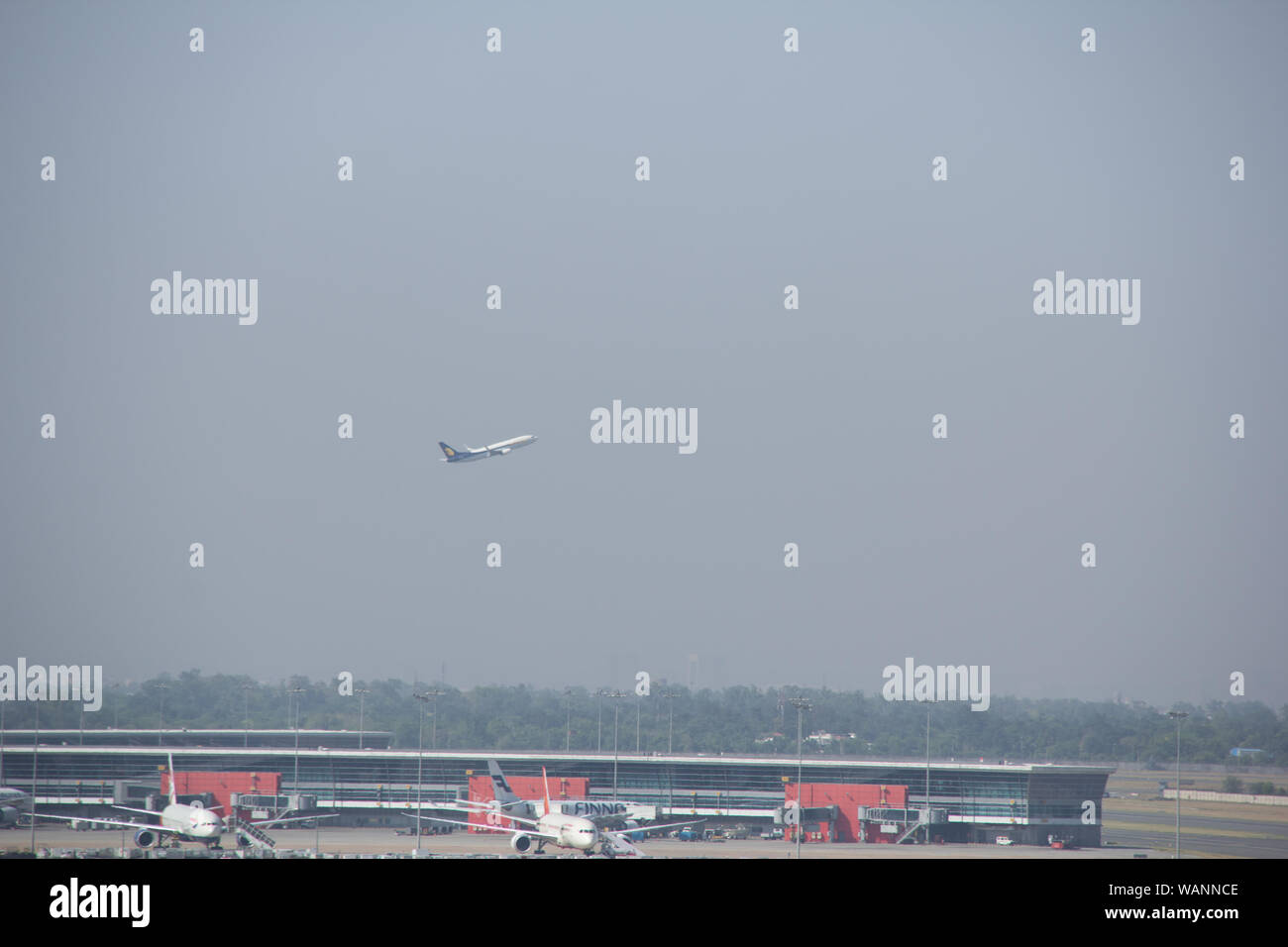 Airplane taking off on a runway, Indira Gandhi International Airport ...