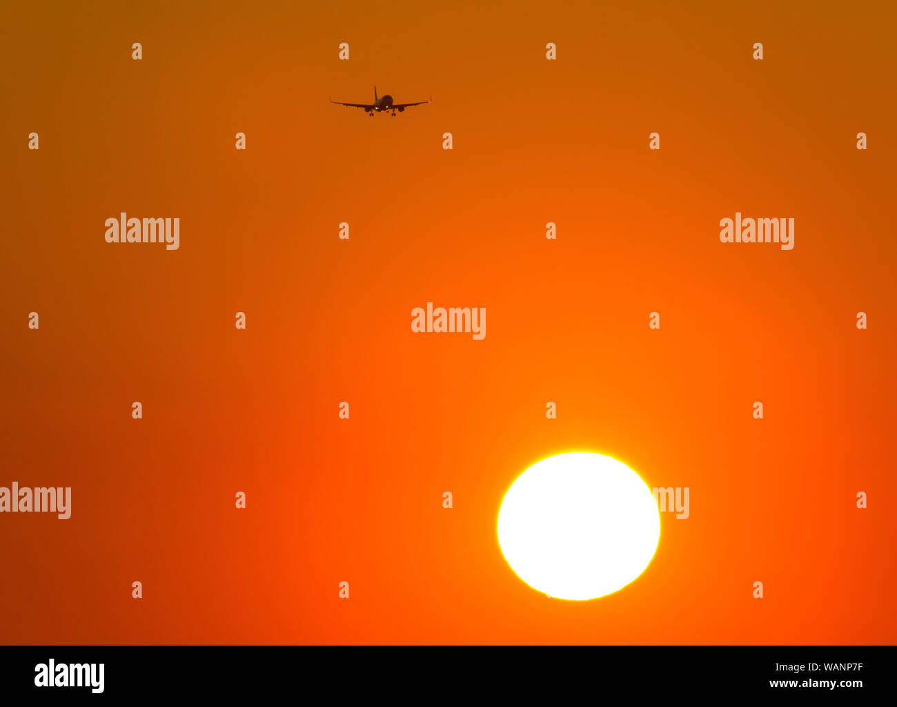 Düsseldorf International Airport, aircraft approaching, sun Stock Photo ...